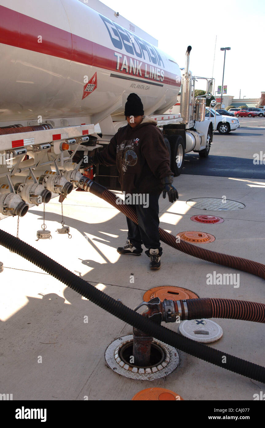 Jerry Howell of Marietta, GA pumps E-85 ethanol mix fuel into his 2005 ...