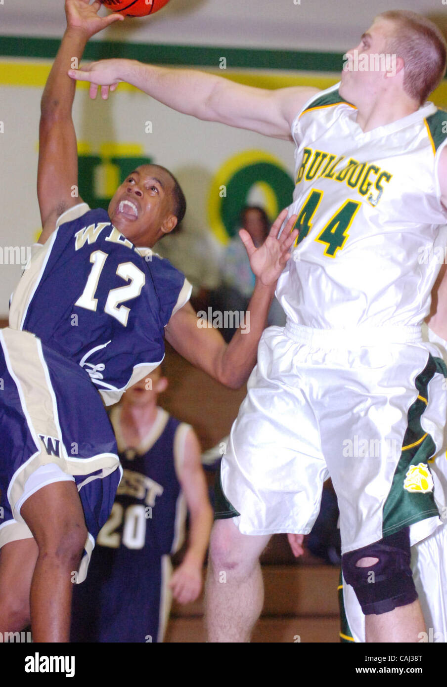 West High basketball player Darius Turner tries to shake Tracy High's ...