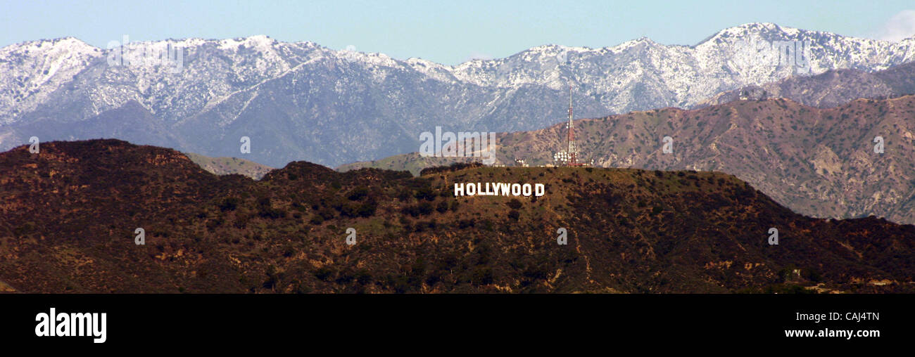 Snow covered the mountains behind the Hollywood sign is seen Monday ...