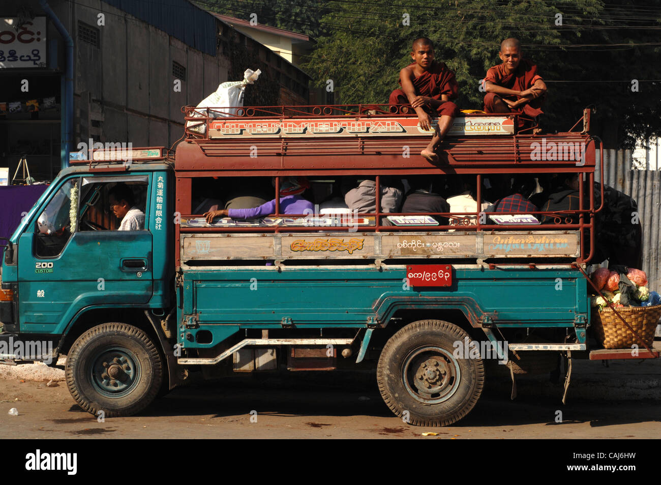 Jan 09, 2008 - Mandalay, Burma, Myanmar - Two Burmese monks sit atop a ...