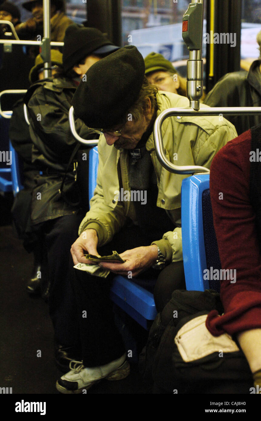 JAmes O'Hare counting his money on the M11 bus headed downtown. James O ...
