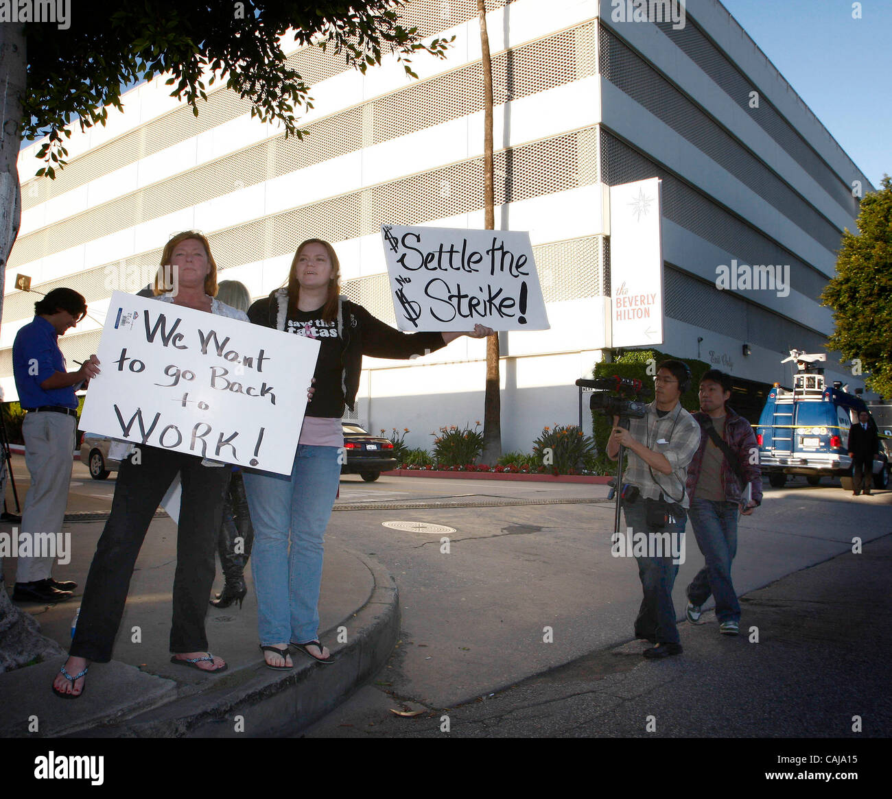 {L-R) Vicki Marsik with her daughter Rachael holds signs in front of ...