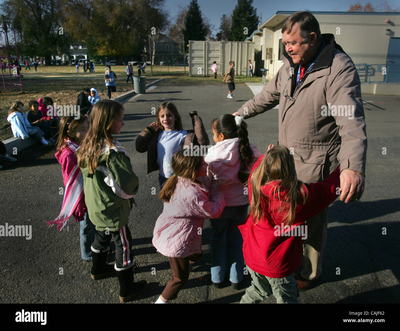 JUMP - Children on recess flock to principal Doug Escherman for a hug ...