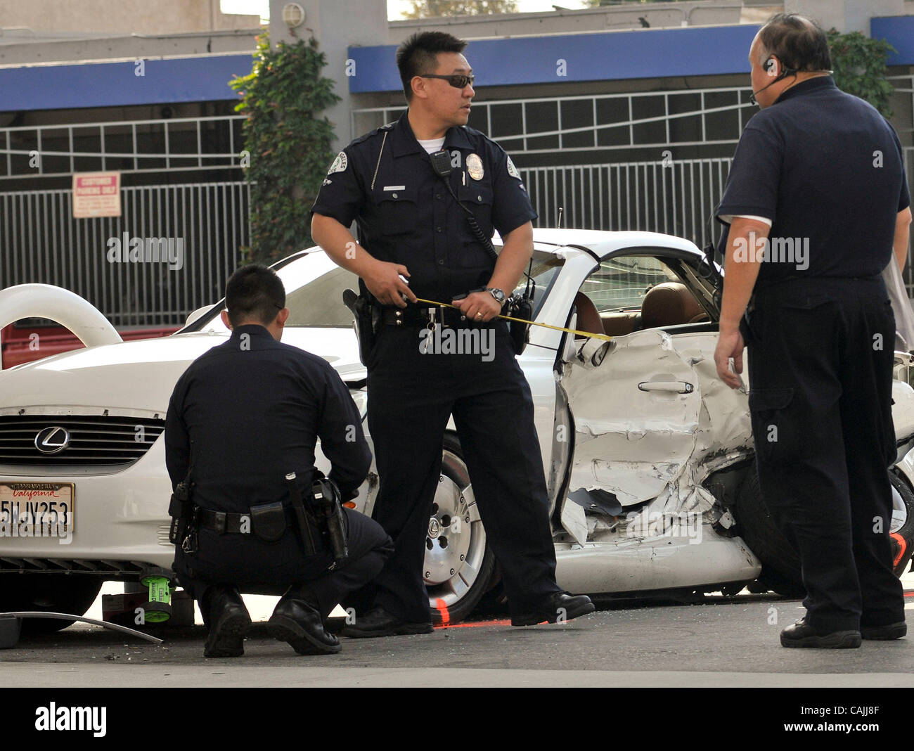 A Convertable Lexis becomes part of a crime scene in Los Angeles, Calif ...