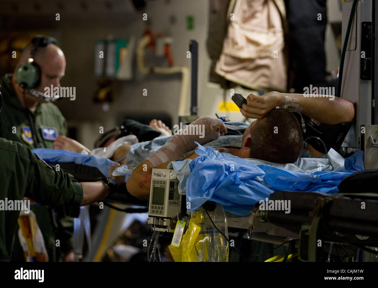 A seriously injured soldier wounded in Afghanistan , is tended to by ...