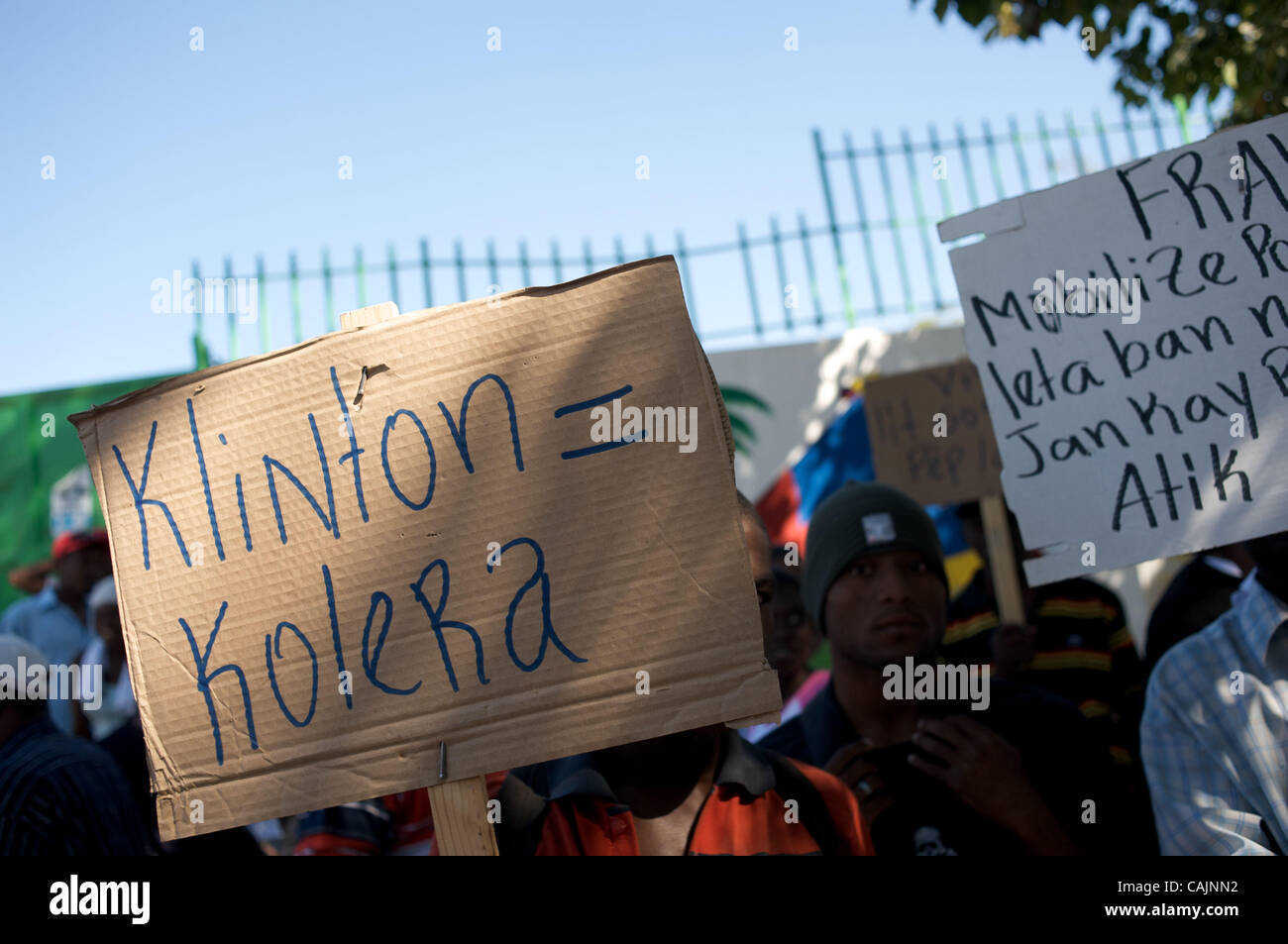 Jan 12, 2011 - Port-au-Prince, Haiti - A Haitian protester hold a sign ...