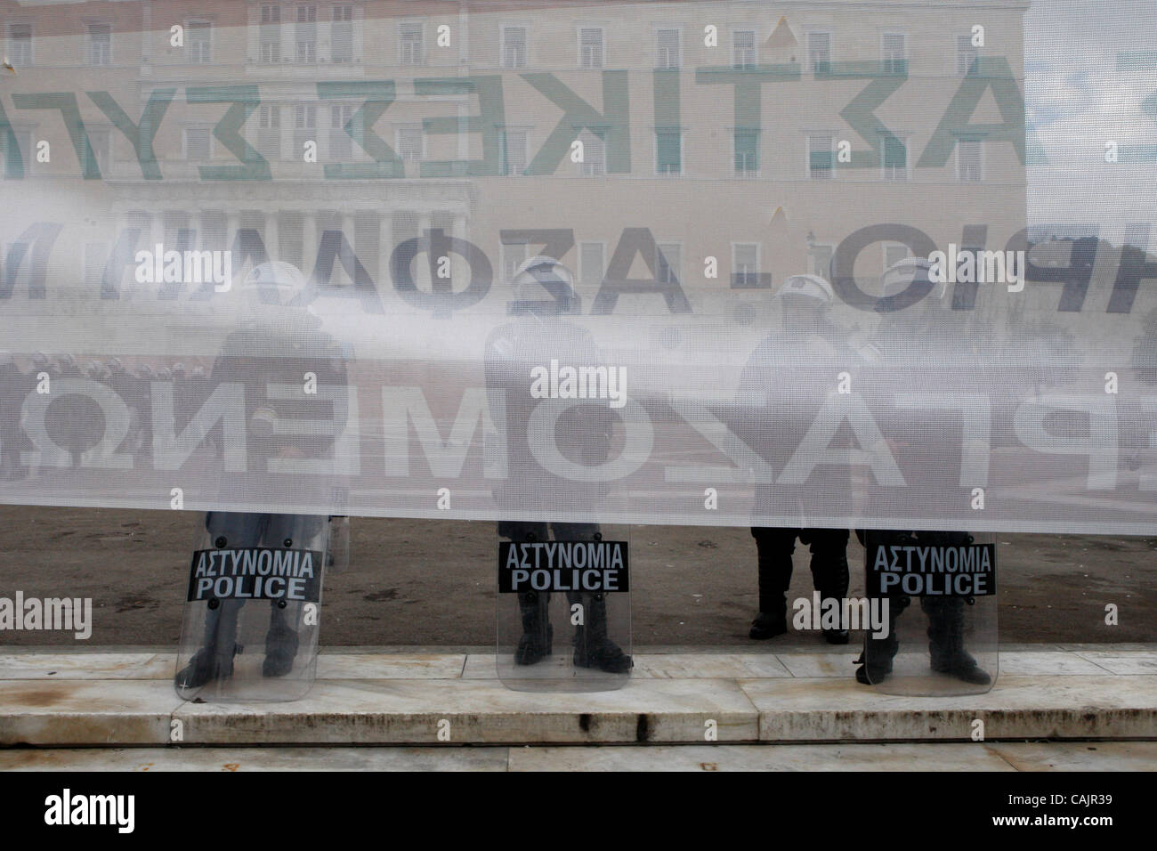 Jan. 13, 2011 - Athens, Greece - Riot police behind the banner. Workers ...