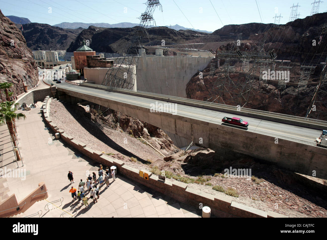 Hoover Dam, also known as Boulder Dam, is a concrete gravity-arch dam ...