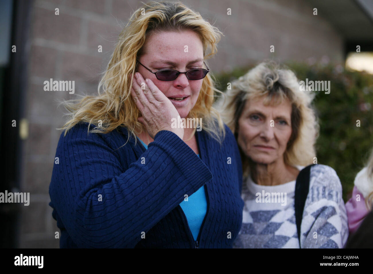 Heidi Patterson, left and family friend Sharon Babb, wait for Patterson ...