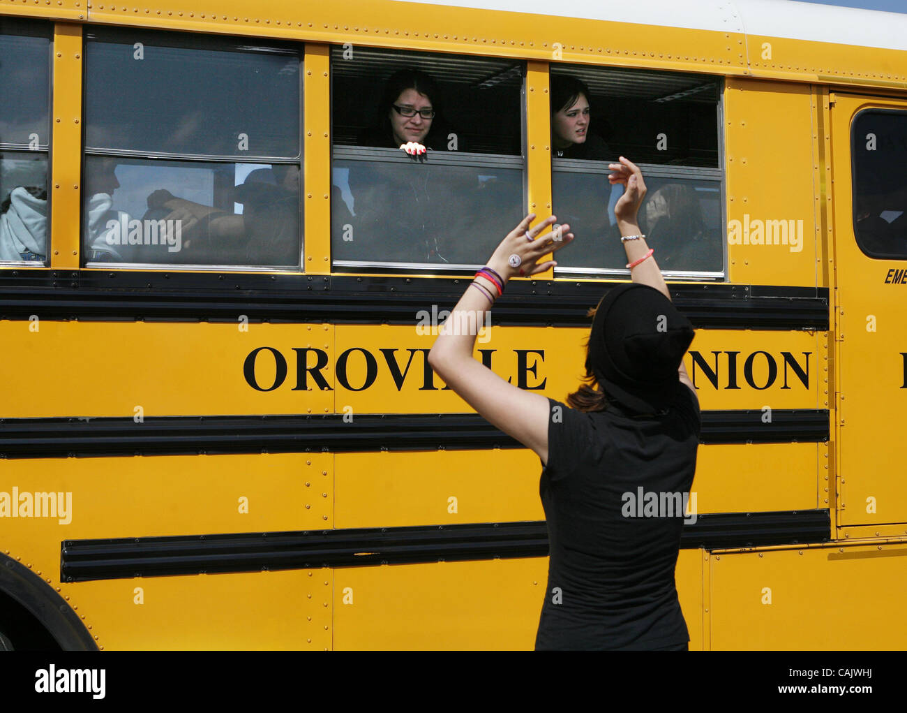 Debi Smith greets her twin sister and friend on the bus used to ...