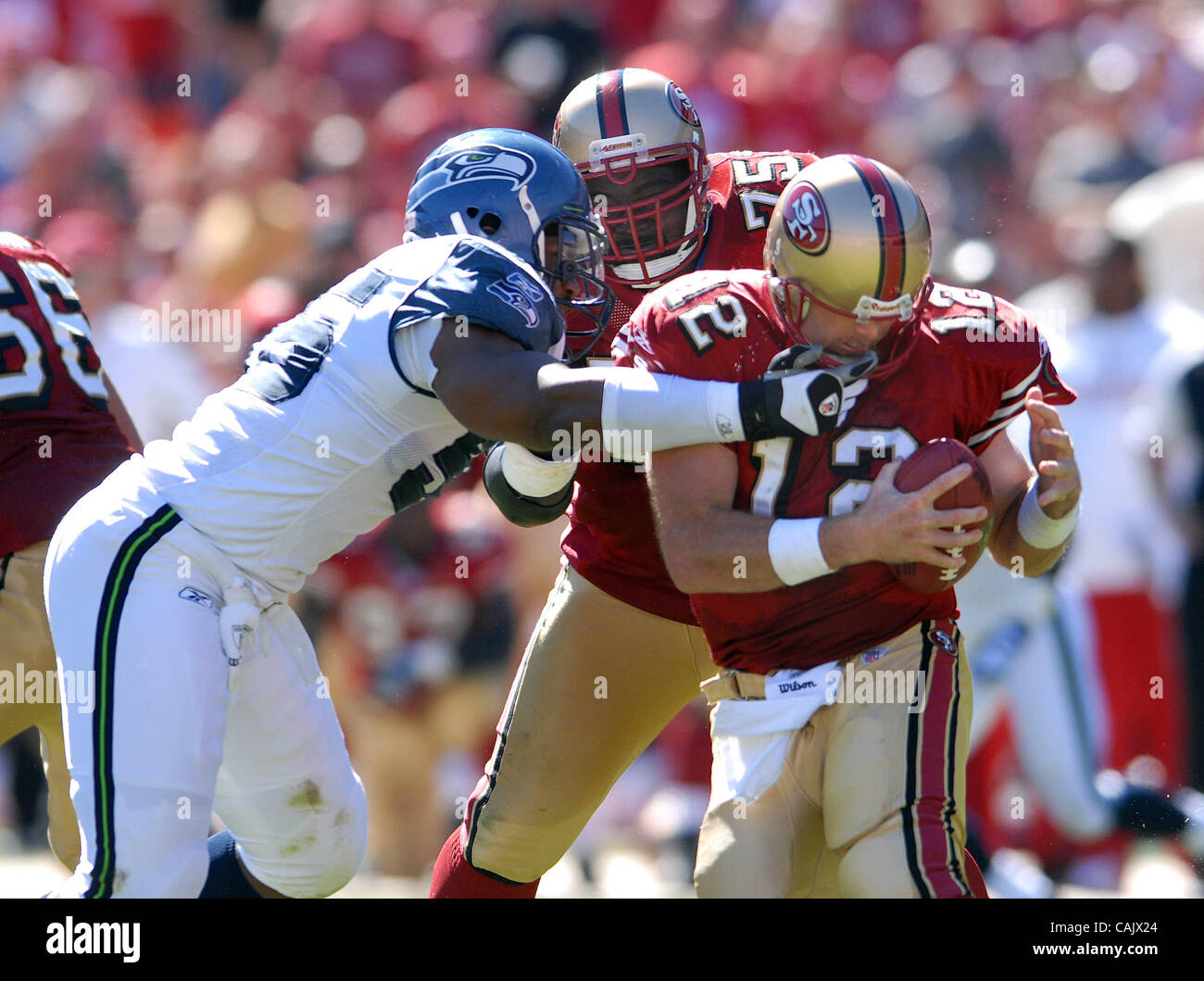 49ers quarterback Trent Dilfer gets sacked by Seattle's Darryl Tapp in ...