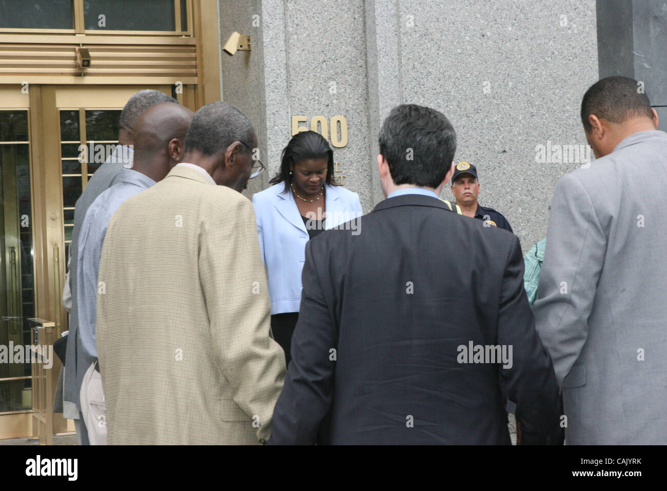 Anucha Browne Sanders praying outside of Manhattan Federal court Oct. 2 ...