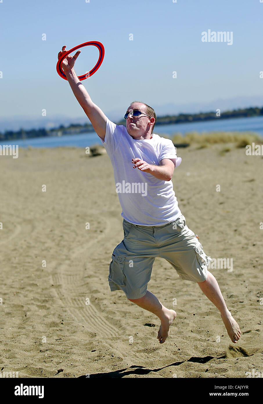 Jonathan Griffis, visiting from Alabama, makes a leaping cathch while ...