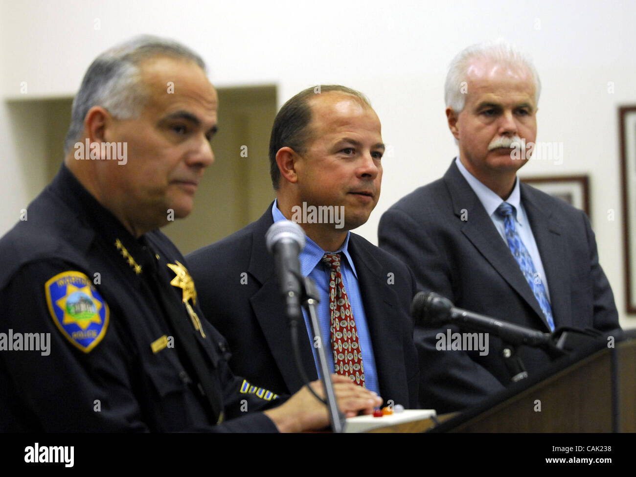From left, Martinez police chief David Cutaia, Sgt. Gary Peterson, and ...