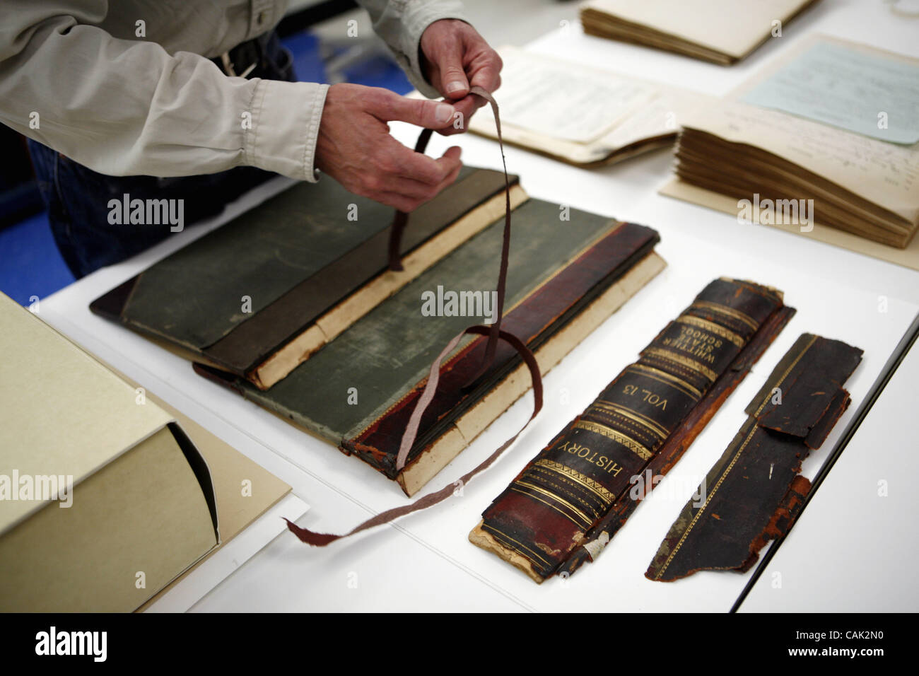 Kevin Turner, a document preservation tech, works to restore an old ...