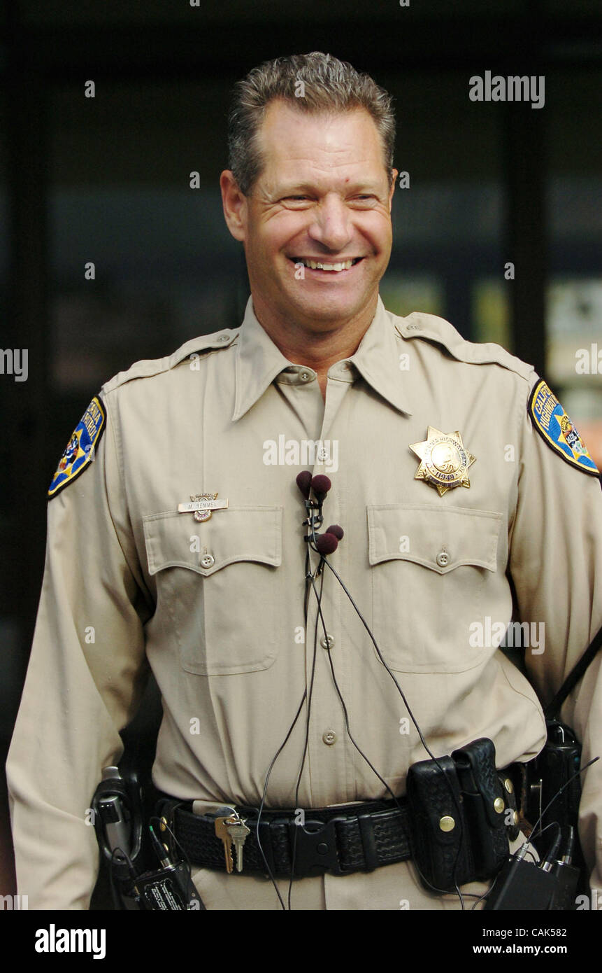 OUT FRONT - Officer Mike Remmel smiles for the media before an ...