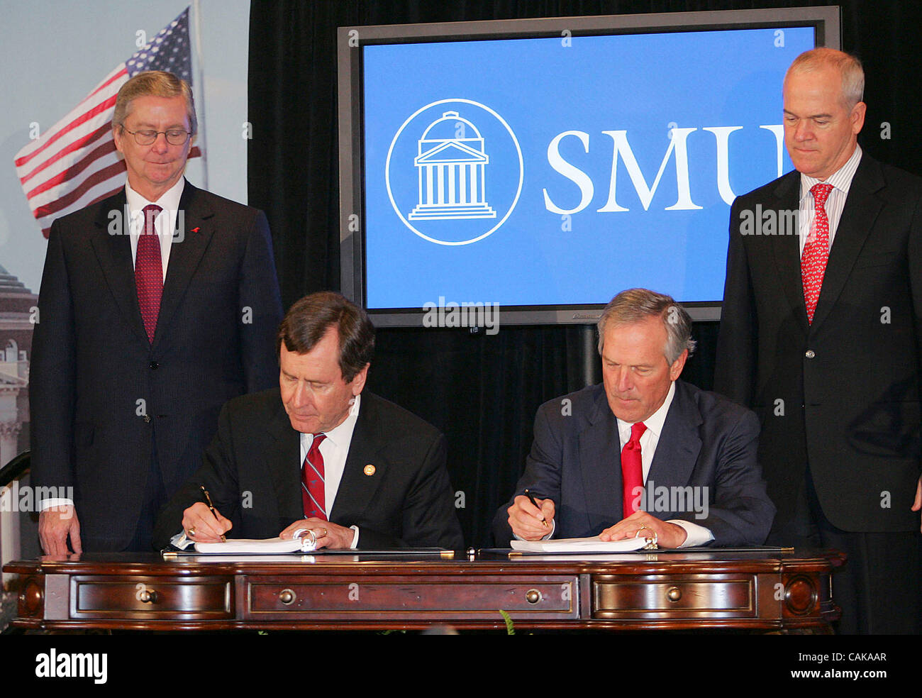 SMU President R. GERALD TURNER, left center, and Bush Foundation ...