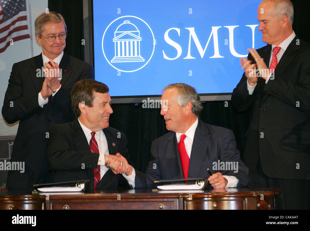 SMU President R. GERALD TURNER, left center, and Bush Foundation ...
