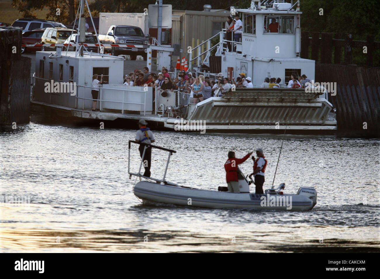 SECOND - NOTE THE DATE - Onlookers on the Real McCoy Ferry watch for ...
