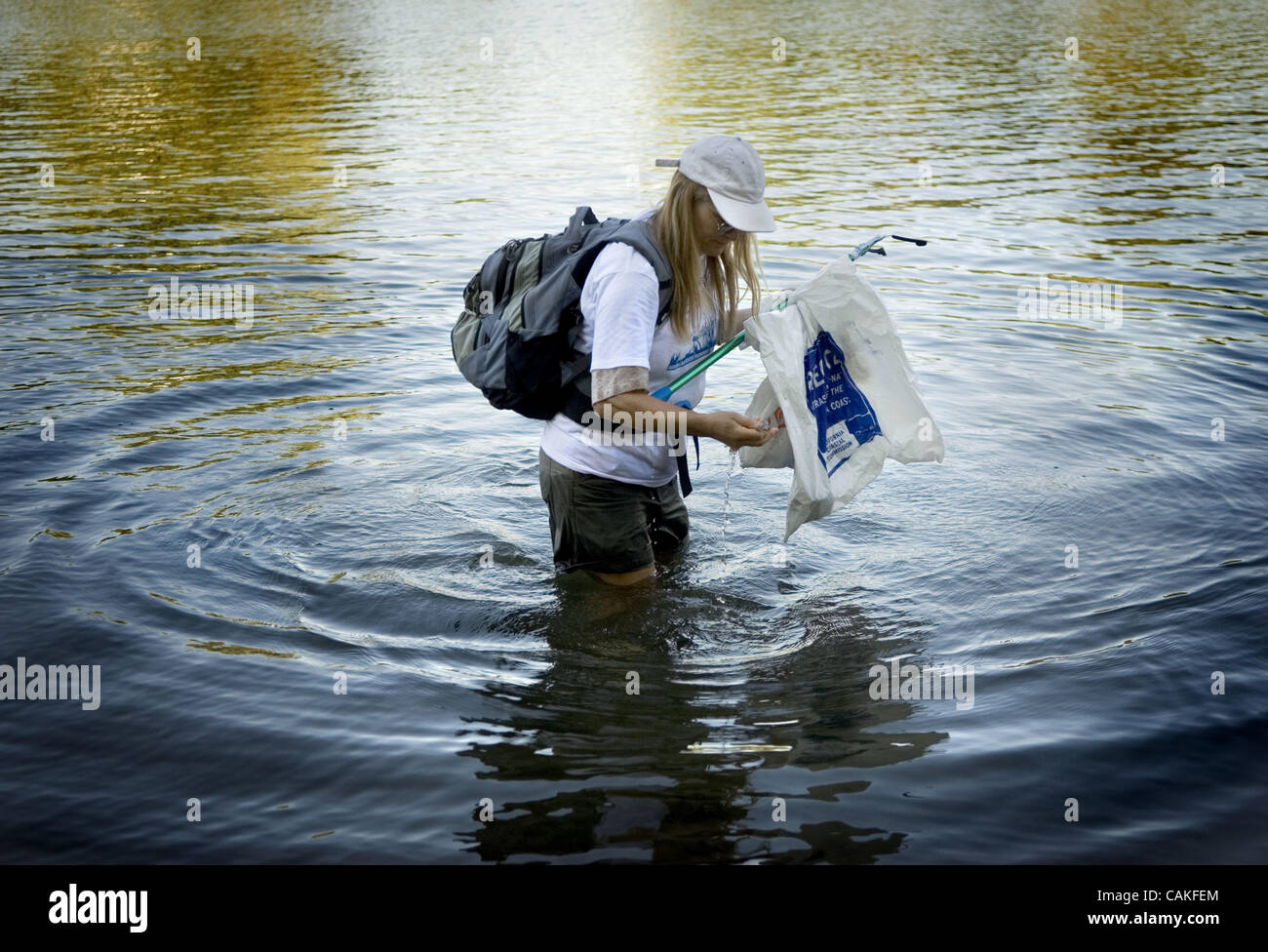 SECOND - Mary Tappel, of North Sacramento, searches for trash at ...