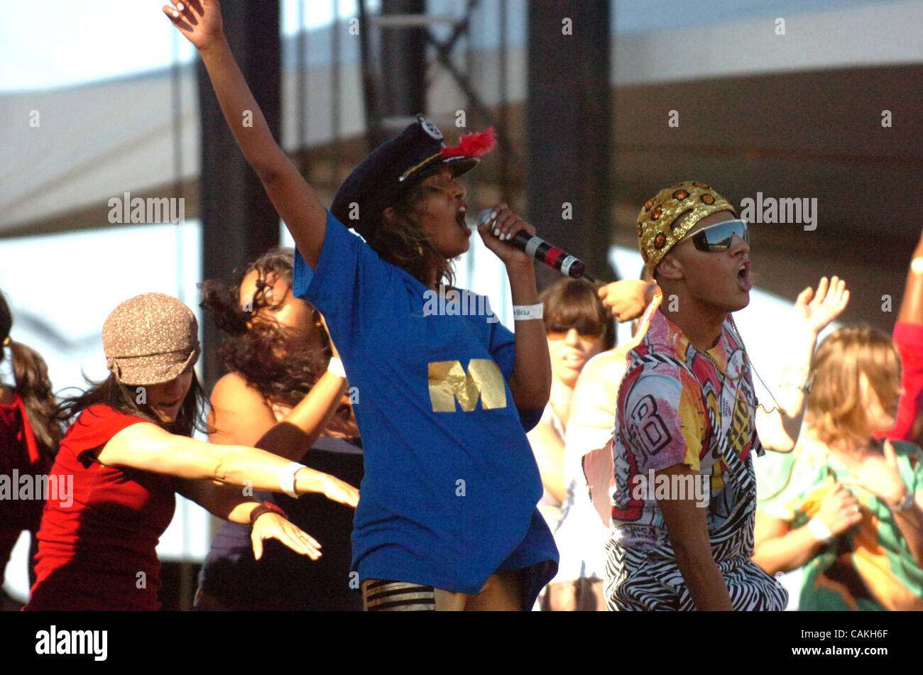 Fans dance on stage with British hip hop artist M.I.A performs Saturday ...