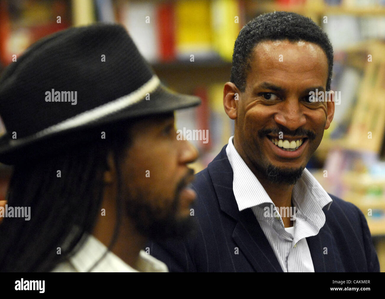 Jerry Thompson (right) looks on while Duane Deterville, co-author of ...