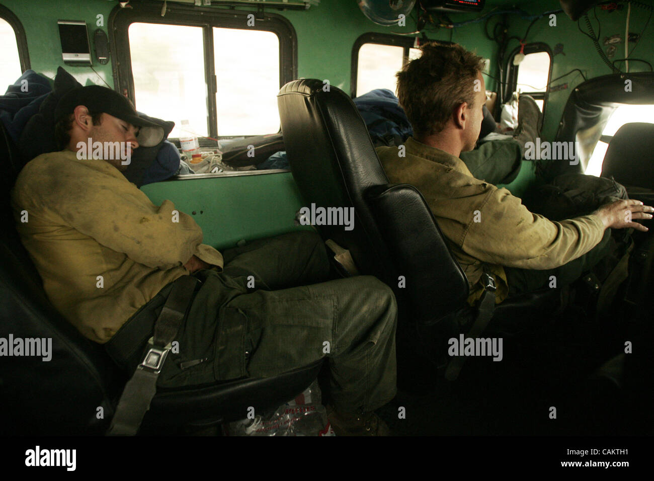 Photo by: Guy Kitchens Del Rosa Hotshot Seth McKinney sleeps on the way ...