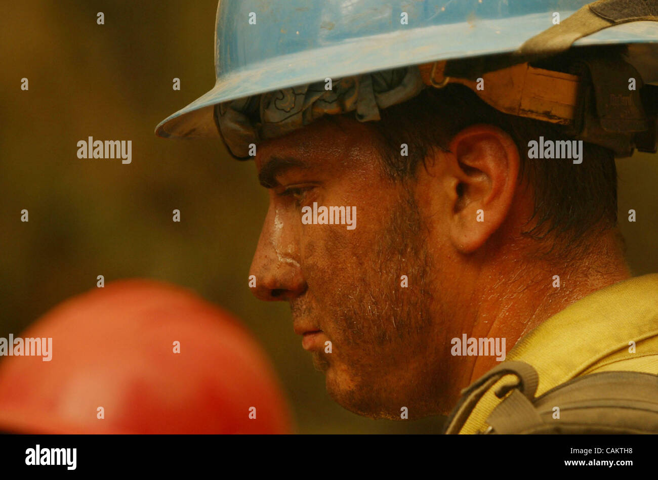 Photo by: Guy Kitchens Del Rosa Hotshot Eddie Apodoca takes a pause ...