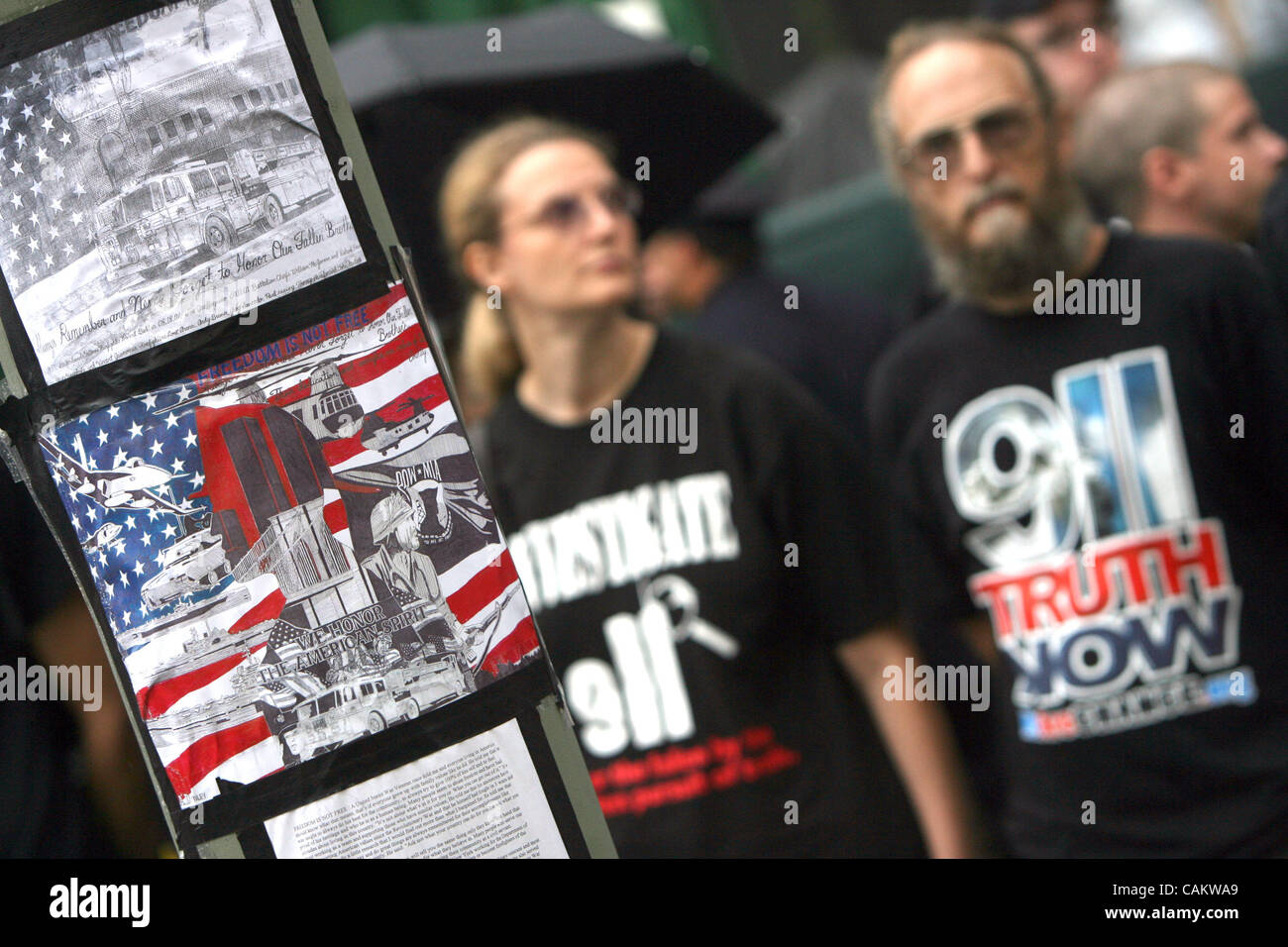 demonstrators are standing on the perimeter of ground zero on the sixth ...