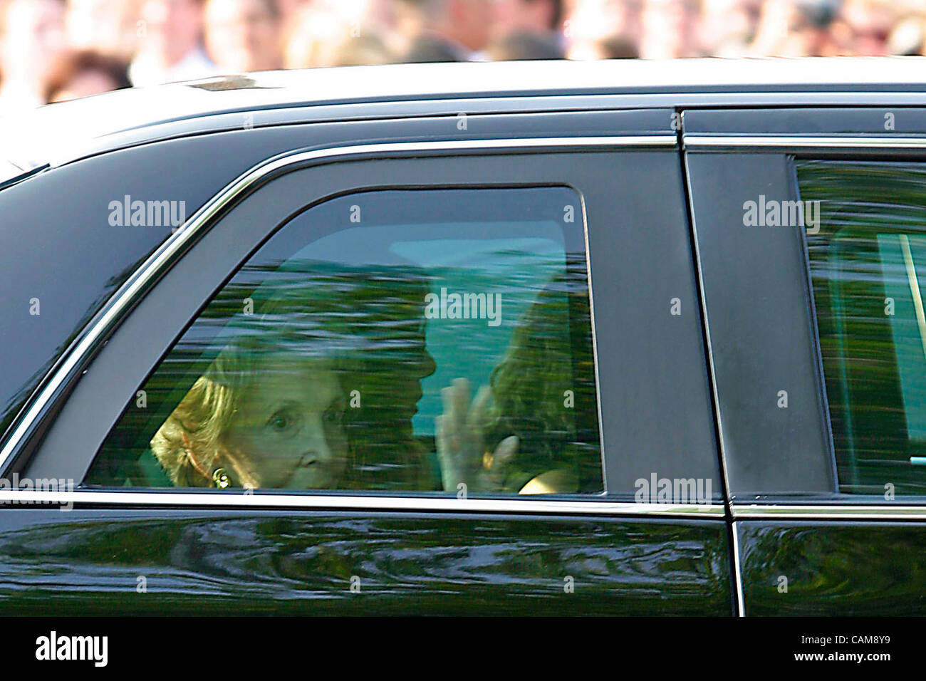 Former first lady NANCY REAGAN waves to the on-lookers as her limo ...