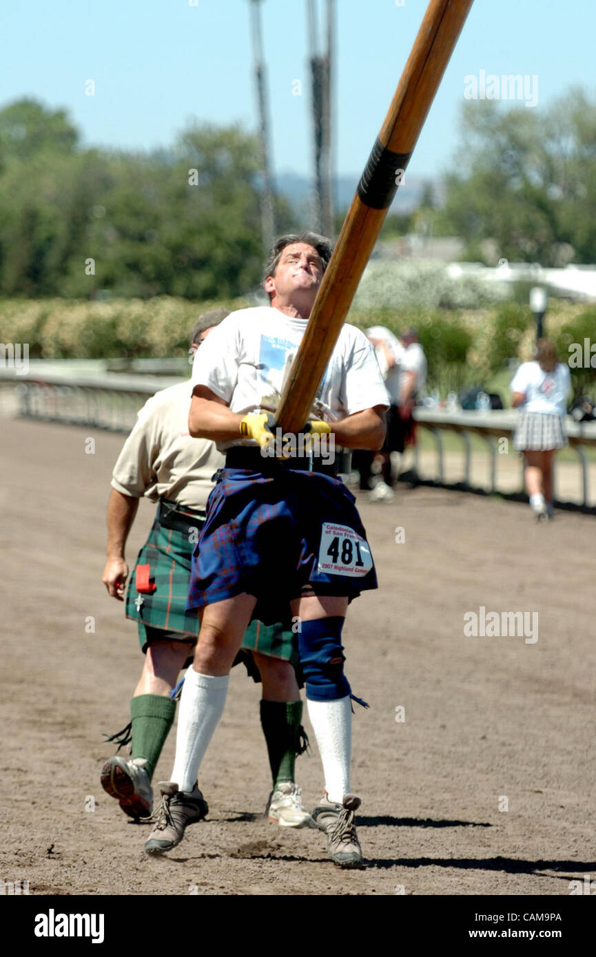 Jack Magee of Pioneer, Calif., competes in the caber toss at the 142nd ...