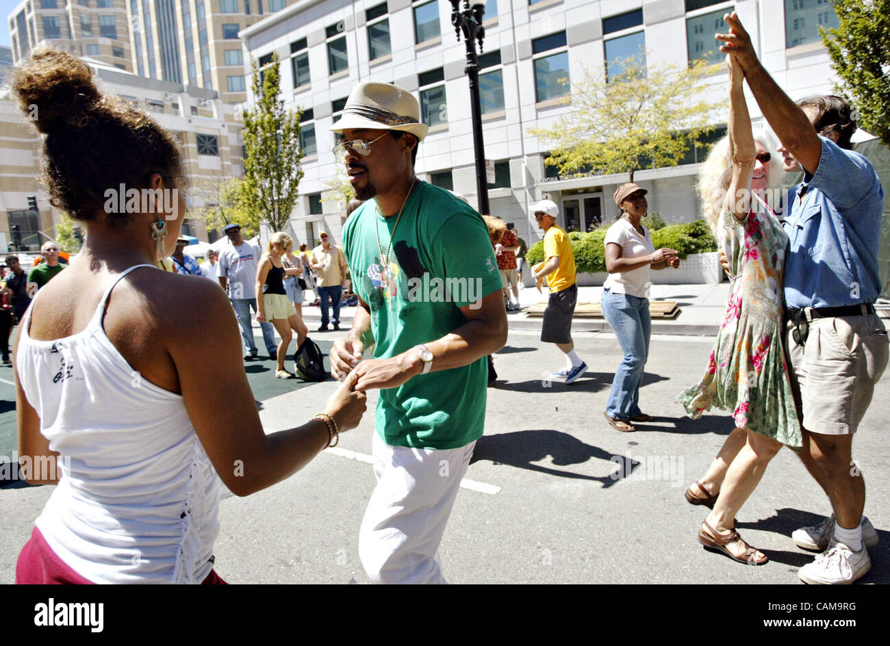 Jerry Limon (right) and Ashley Karell dance to the latin beat of ...