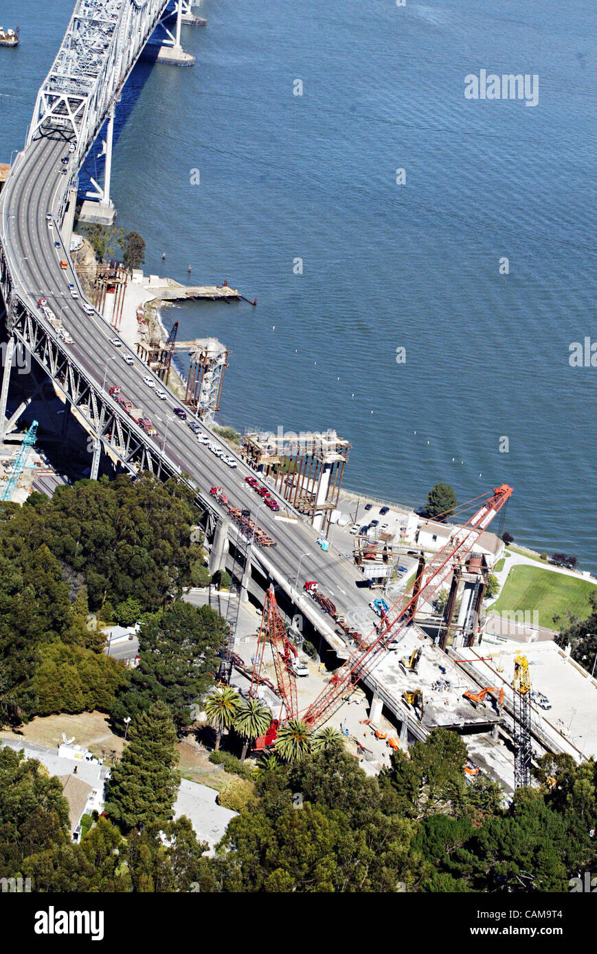 Workers from C.C. Meyers demolish a 350-foot section of the eastern ...