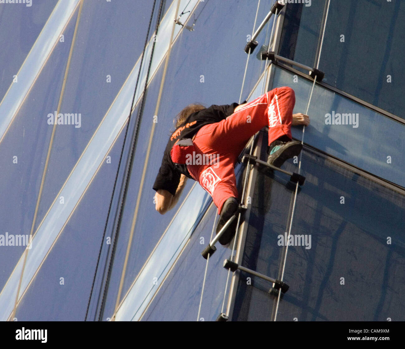 French urban climber Alain Robert scaled the 242-meter Federation Tower ...