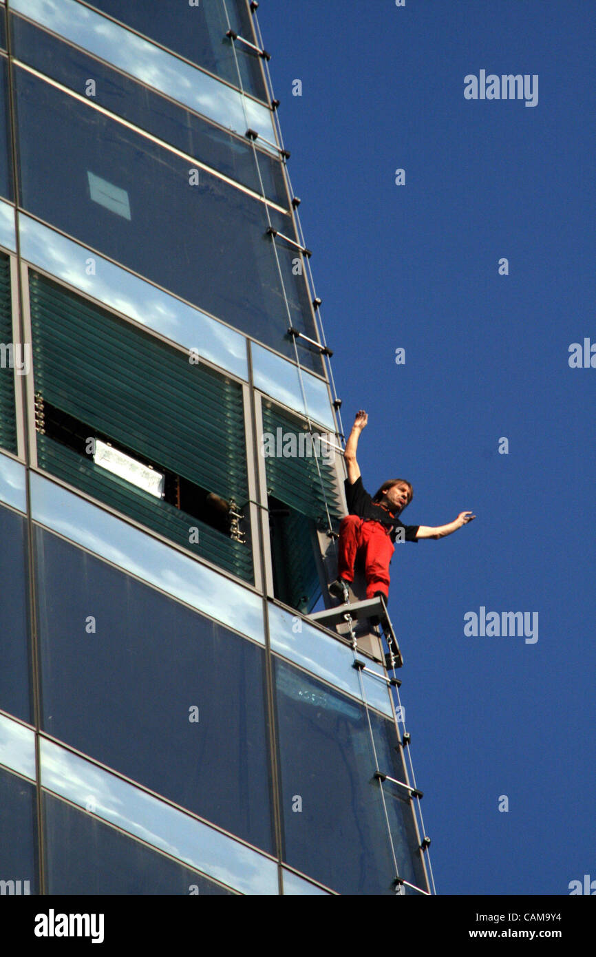 French urban climber Alain Robert scaled the 242-meter Federation Tower ...