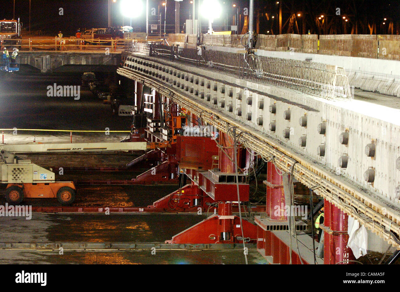 Construction workers from CC Myers Inc. roll out the 6,500 ton new ...