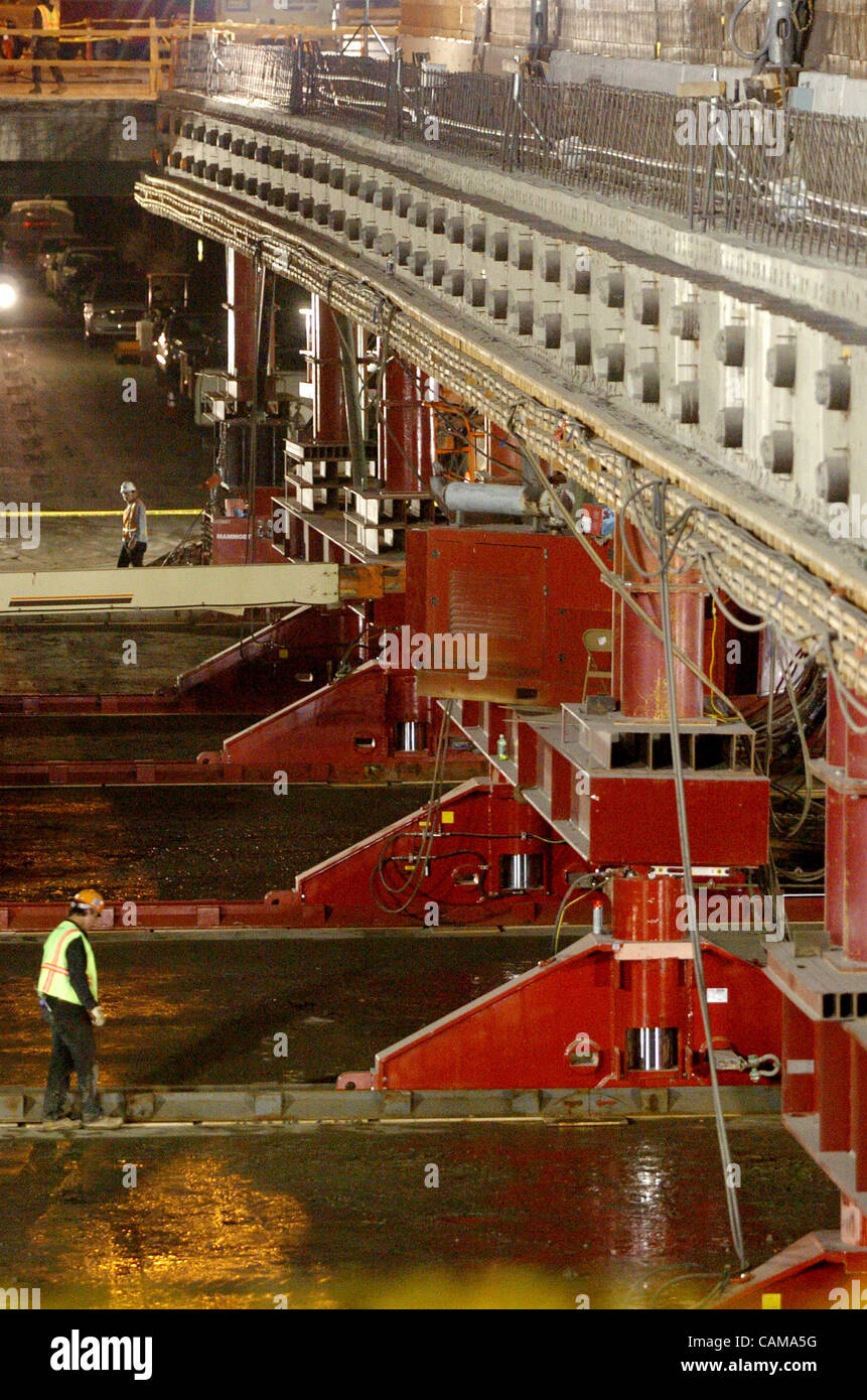 Construction workers from CC Myers Inc. roll out the 6,500 ton new ...