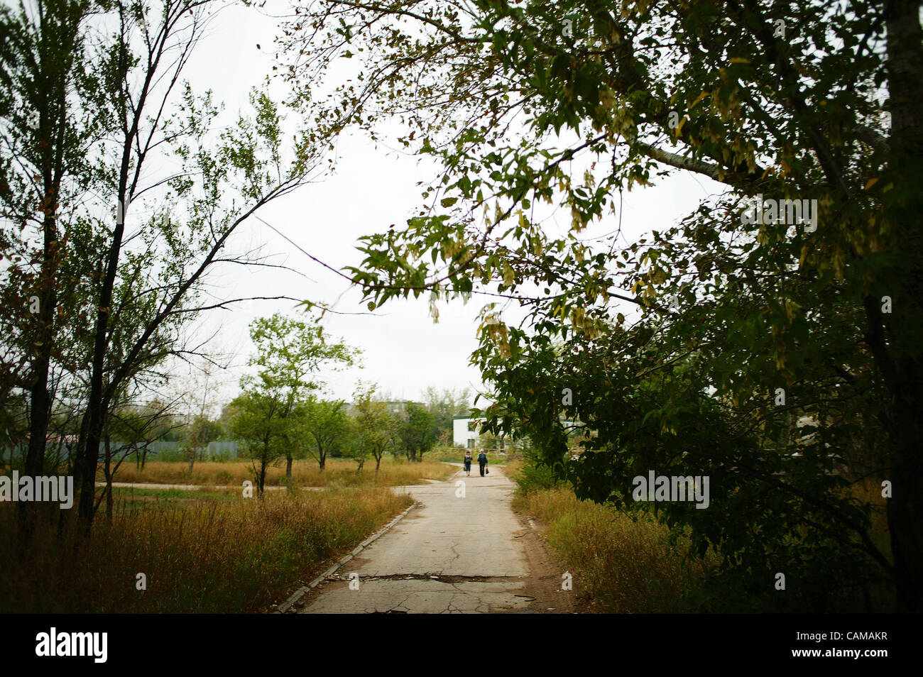 Villagers walks a path in Stepnogorsk Kazakhstan September 4, 2007. The ...