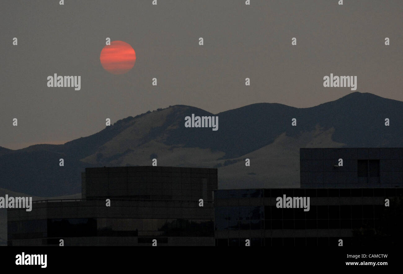 STANDALONE--The rising sun over Walnut Creek, Calif., is obscured by ...