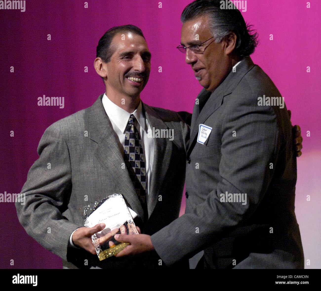Tony Ramirez, of Dover Elementary School, left, is given an award by ...