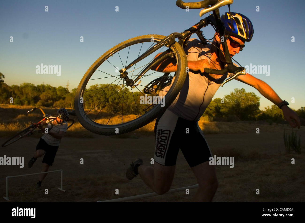 JUMP: Cyclocross student Max Whittaker, right, negotiates obsticales ...