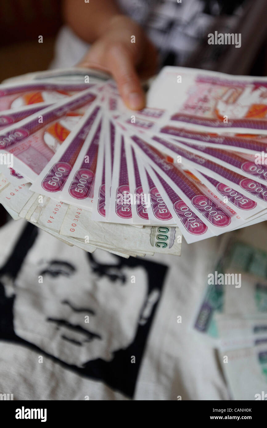 Photo shows Myanmar's kyat currency in Yangon, 31 March 2012. The ...