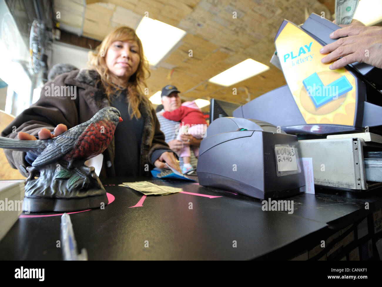 Maria Rodriguez rubs a blue bird statue with her newly purchased Mega ...