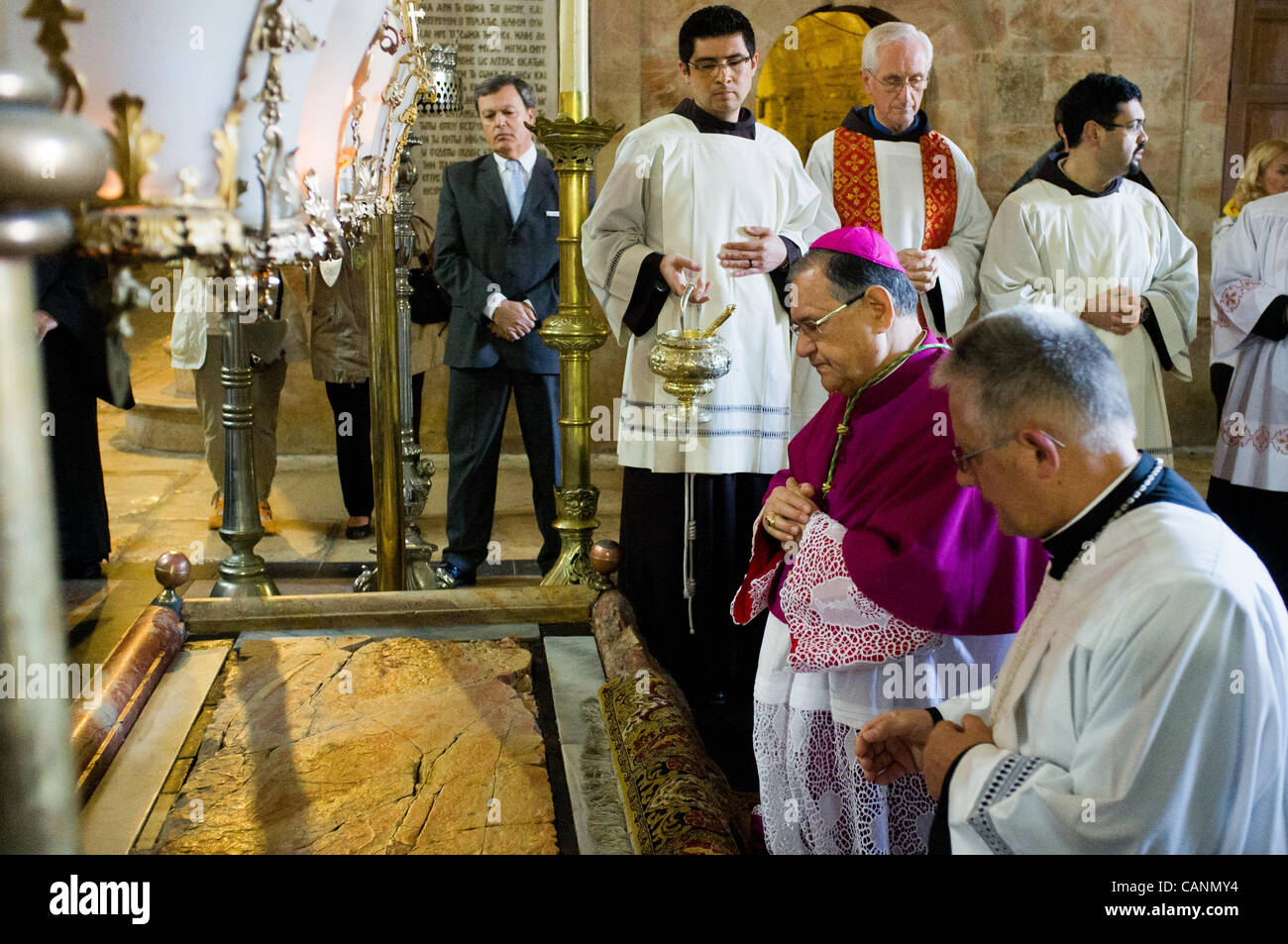 Latin Patriarch of Jerusalem, Archbishop Fouad Twal, kneels before the ...