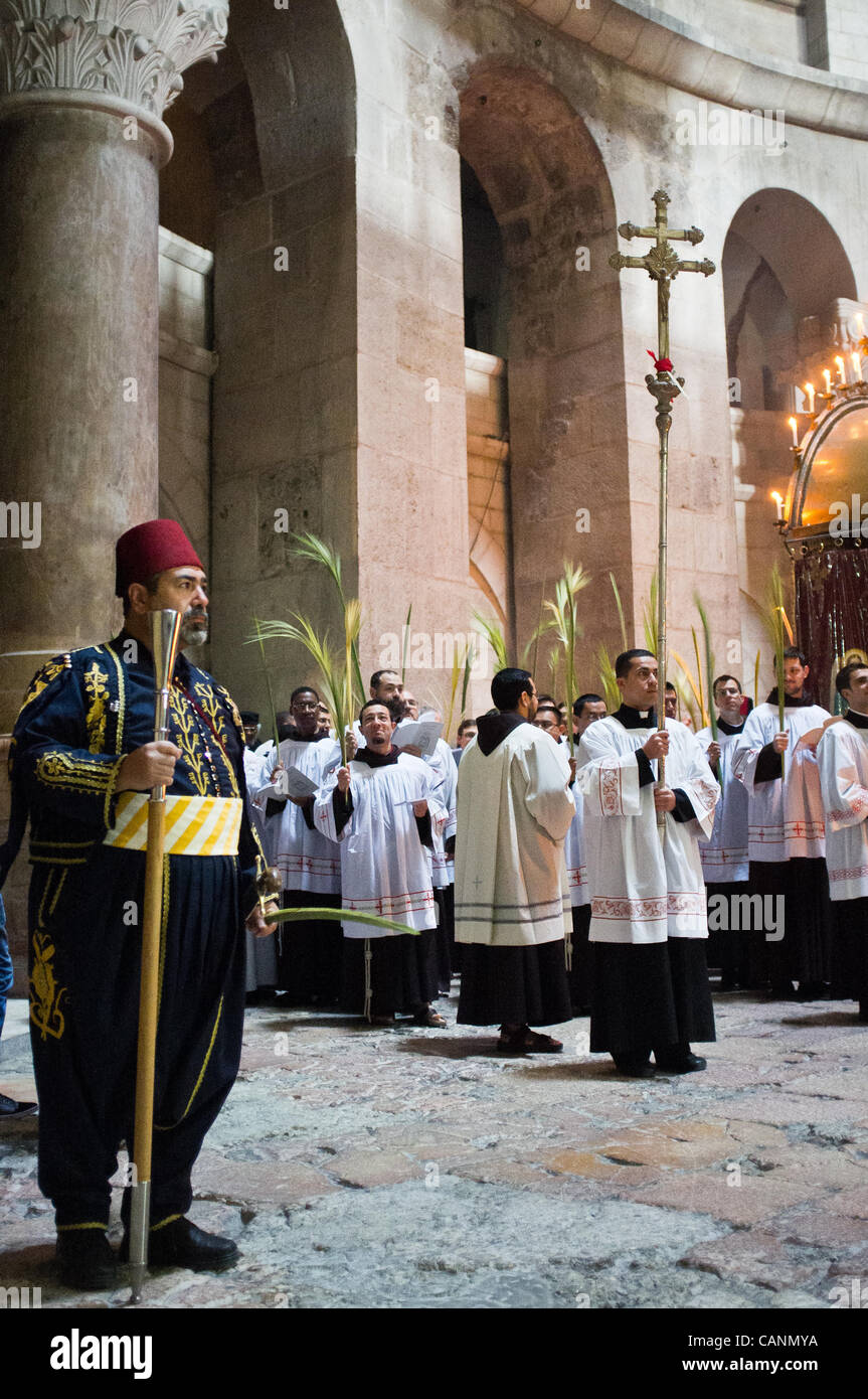 An Armenian scout leads priests carrying palm branches in a Palm Sunday ...