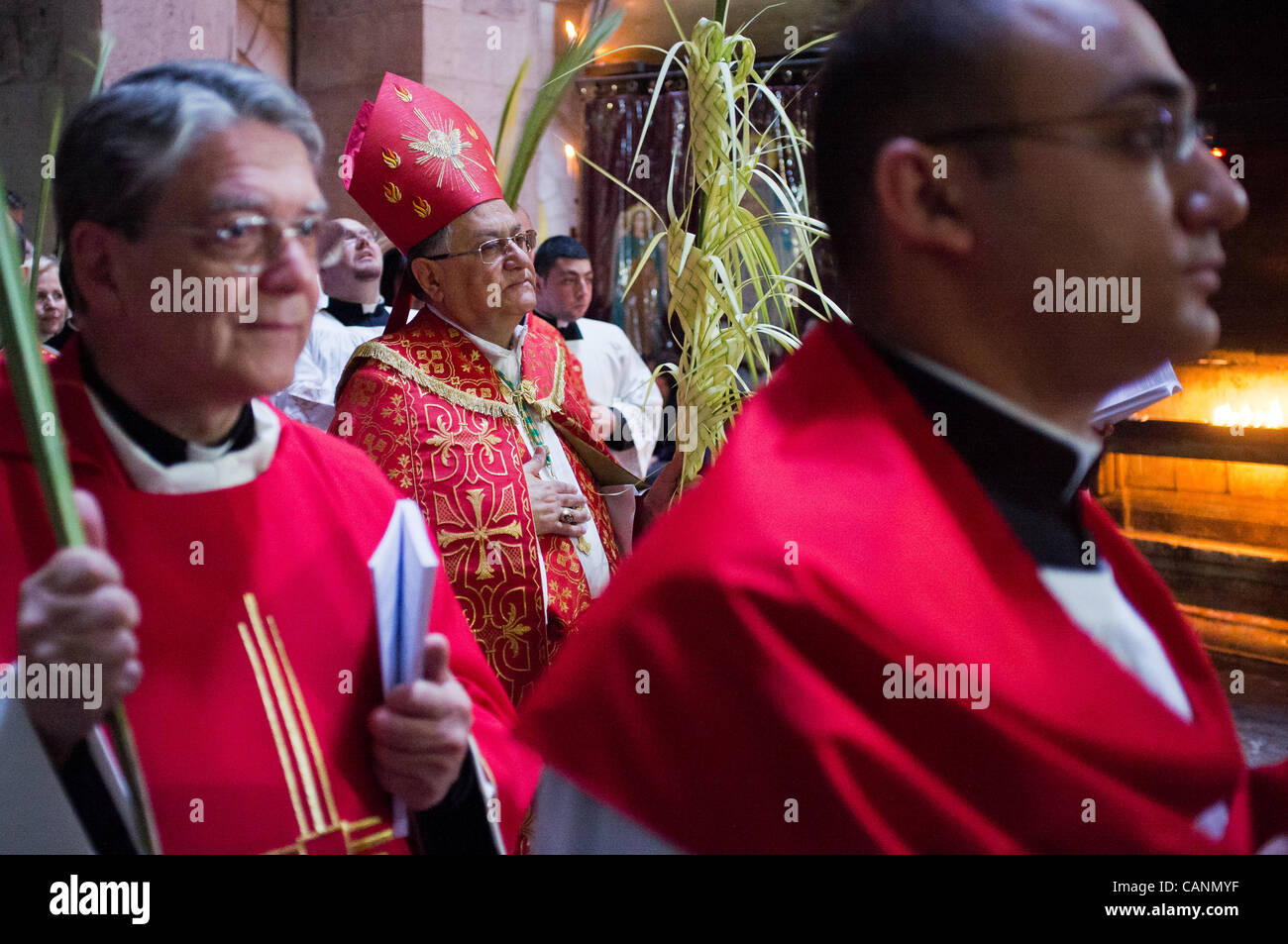 Latin Patriarch of Jerusalem, Archbishop Fouad Twal (C), joins priests ...