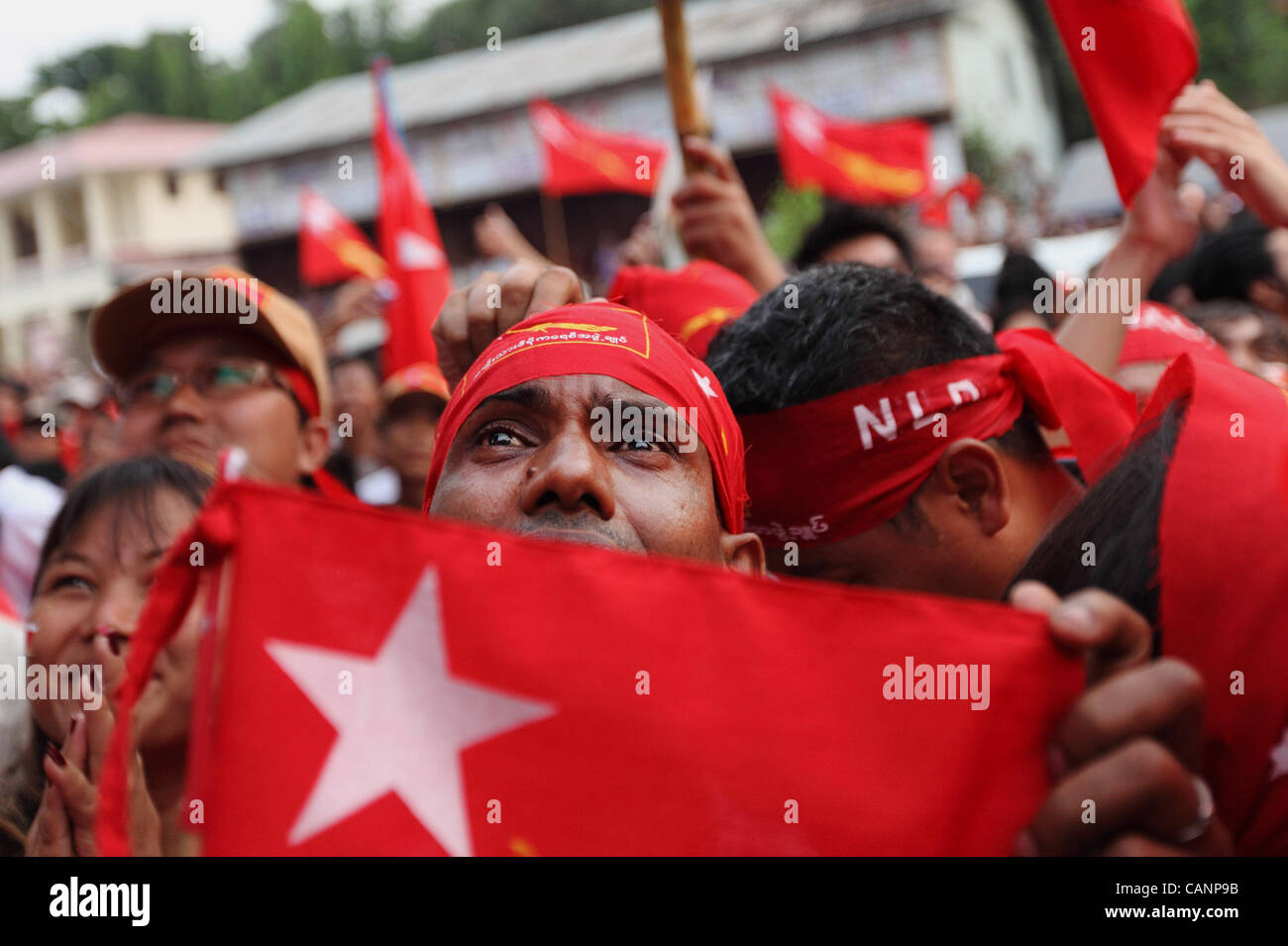 People celebrate at the headquarters of National League for Democracy ...