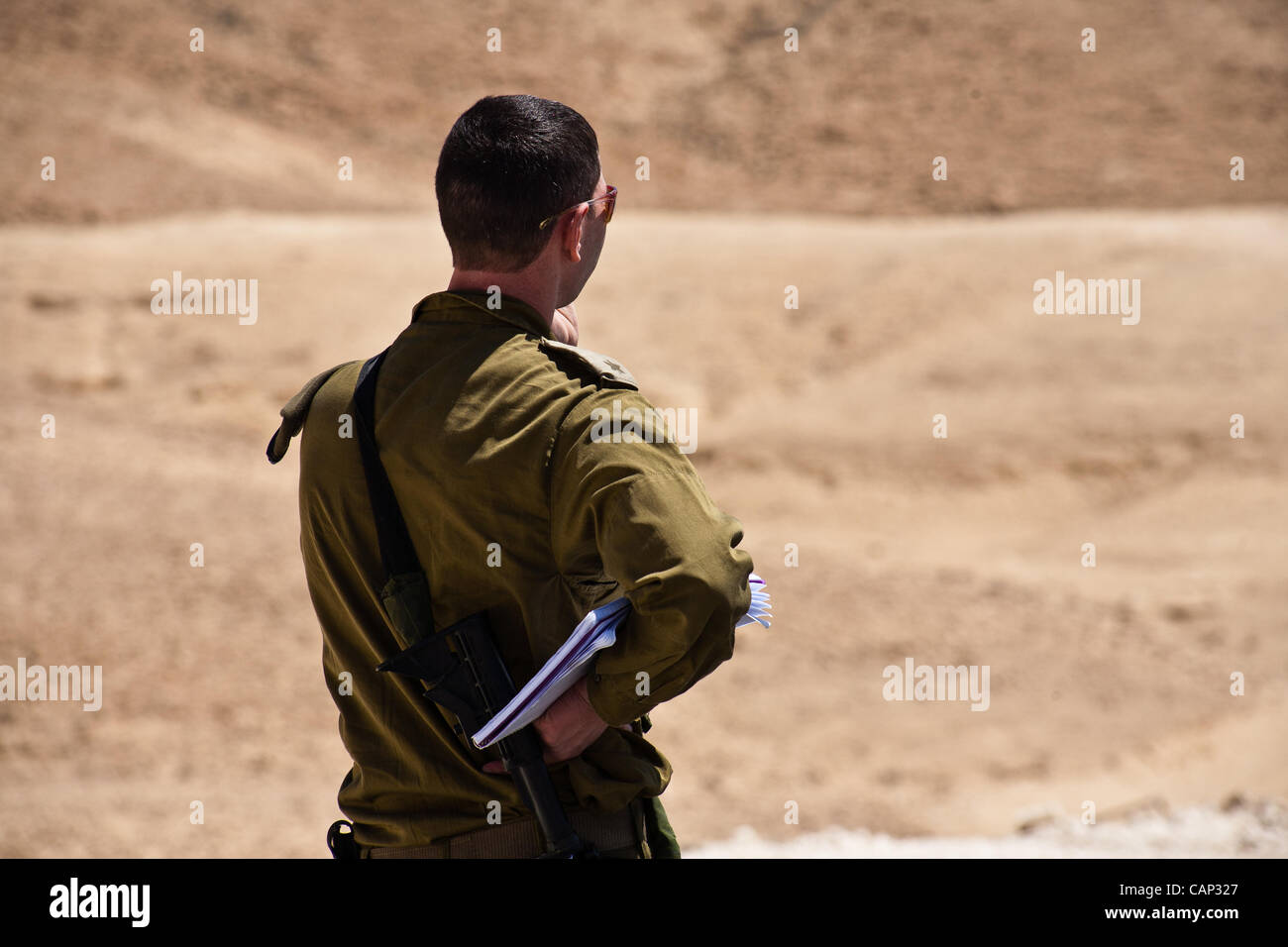 An IDF officer stares into the desert near the new “Hour Glass” Israel ...