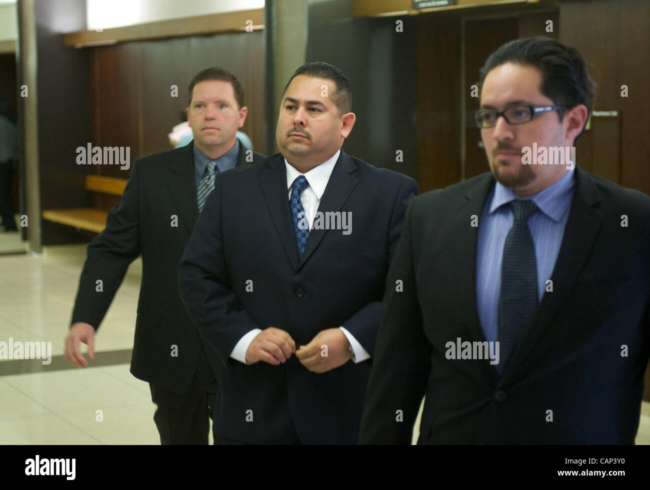 Manuel Ramos and Jay Cicinelli enter the courtroom at the Orange County ...