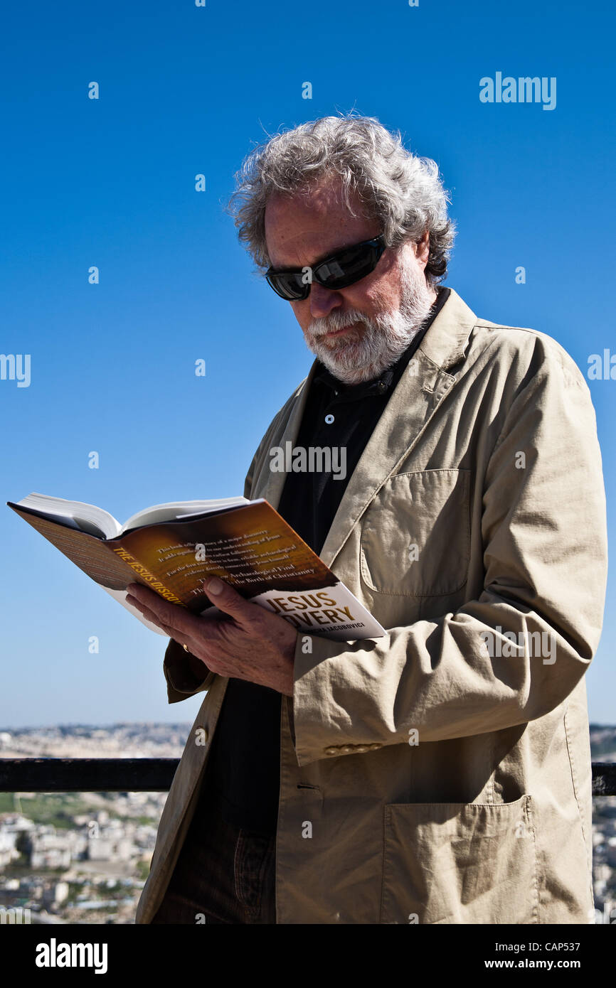 Prof. James D. Tabor looks through his new book detailing recent ...